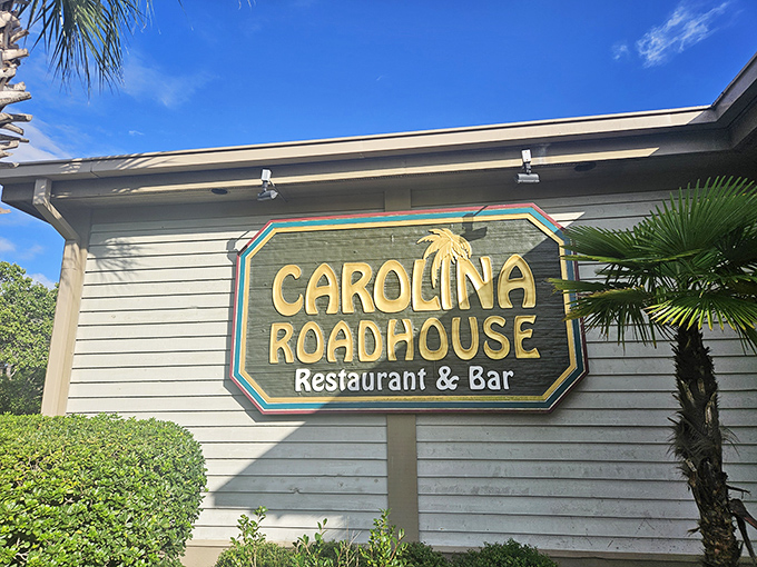 The tropical-themed sign at Carolina Roadhouse promises a laid-back atmosphere where the steaks are anything but casual.