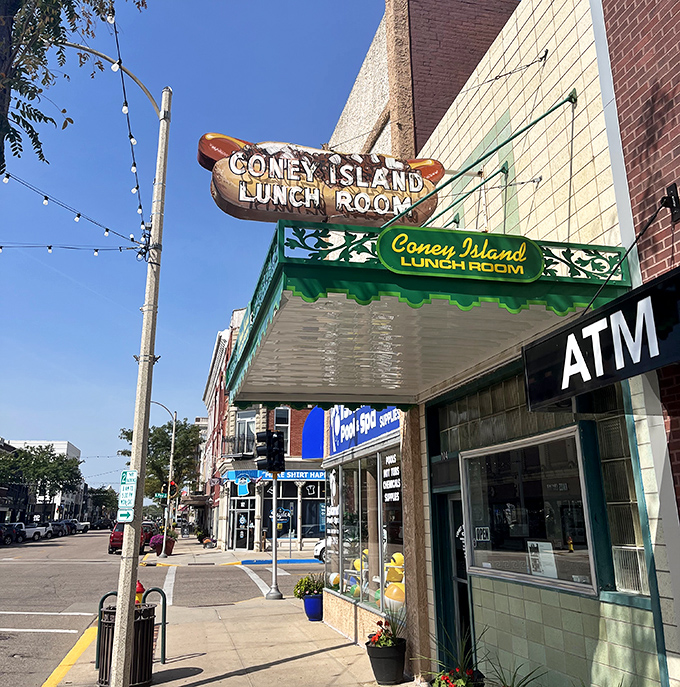 Downtown charm meets hot dog heaven at Coney Island Lunch Room, where that green awning shelters a Nebraska institution.