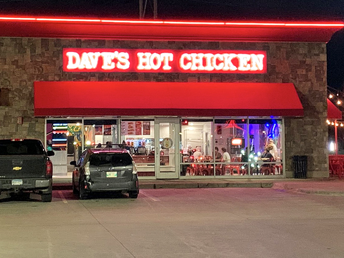 As night falls, Dave's Hot Chicken glows with promise, like a spicy beacon in the Fargo darkness.