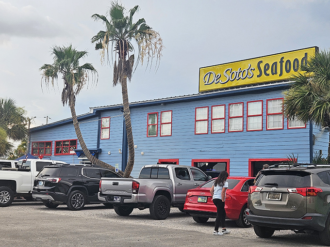 The cheerful yellow sign of DeSoto's Seafood Kitchen stands out against the blue building like sunshine on water. A beacon for seafood pilgrims.