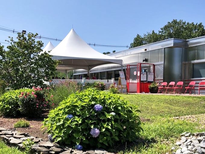 The white picket fence and garden setting of Dream Diner create an unexpected oasis where comfort food meets fresh air and sunshine.