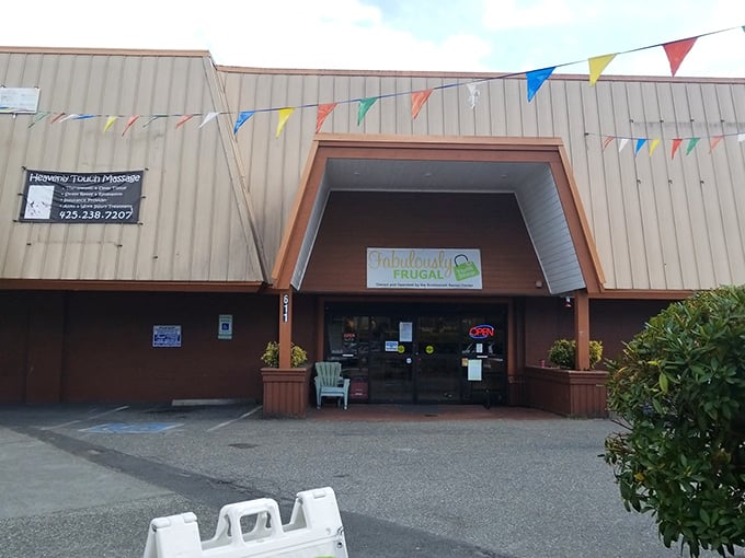 Colorful pennant flags flutter above the entrance, like a permanent celebration of thrift store victories.
