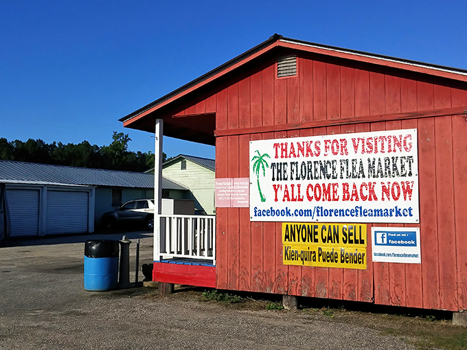The distinctive red building of Florence Flea Market invite visitors with homespun charm and hand-painted hospitality.