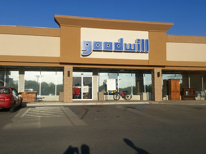 The warm beige tones of this Goodwill store contrast with its cool blue signage &ndash; as inviting as the deals waiting inside.