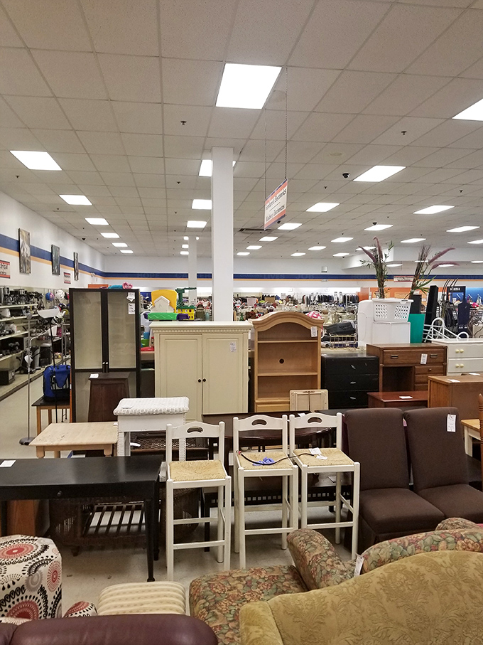 Rows of furniture await new homes at Goodwill. That dining set costs less than dinner for two!