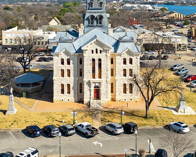 That limestone courthouse anchors a town square that still remembers how community should feel. 