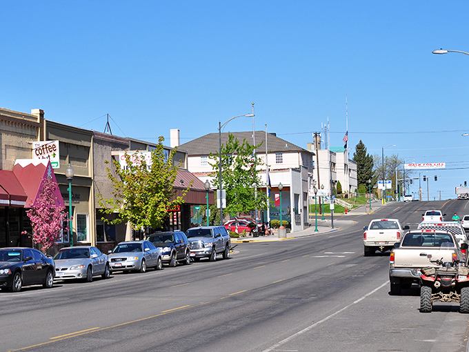 The colorful storefronts of Grangeville's main drag offer a warm welcome, with hanging flower baskets adding charm to this mountain town.