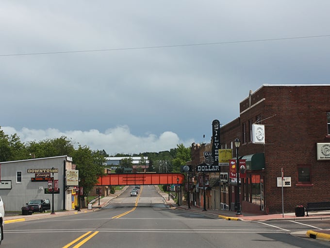Overcast skies frame downtown's brick buildings, creating atmosphere that Hollywood couldn't buy but retirement towns offer for free daily.