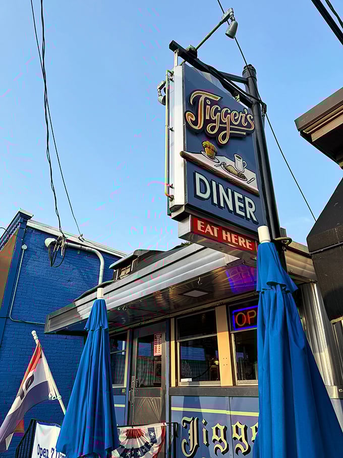 Jigger's vintage sign swings above a slice of small-town perfection. "EAT HERE" might be the best advice you'll get all day.