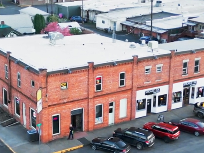 The historic brick buildings of Kamiah stand as monuments to small-town perseverance, framed by Idaho's rolling hills.