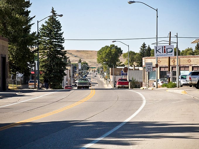The winding road through Kemmerer leads to affordable living, with mountains watching over a town where $1,200 monthly feels generous.