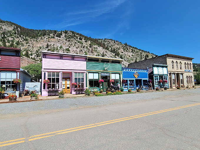 It's like someone spilled a box of crayons and built a town! These vibrant storefronts against rugged mountains create pure Colorado magic.