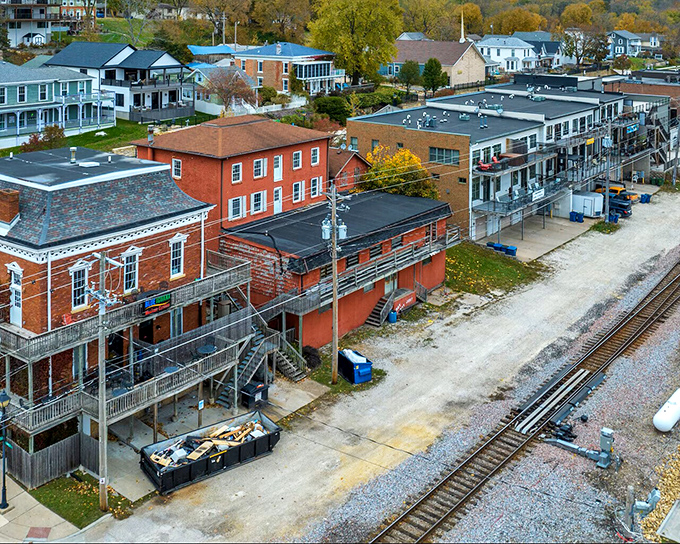 A bird's-eye view of Le Claire reveals its perfect harmony with the landscape&mdash;brick buildings nestled between railroad tracks and rolling hills.