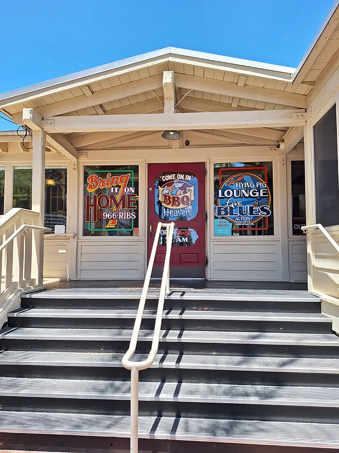 The white porch steps lead to a roadhouse paradise where blues music and BBQ create the perfect harmony.