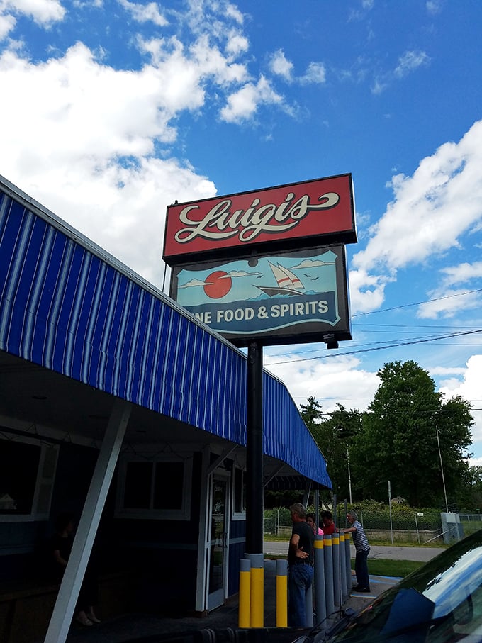 That classic blue awning at Luigi's has sheltered generations of pizza lovers from both sun and hunger pangs.