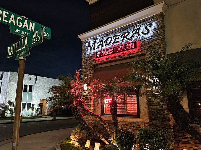 Palm trees and street signs frame this unassuming corner spot. Inside, meat magic happens without any unnecessary fanfare.