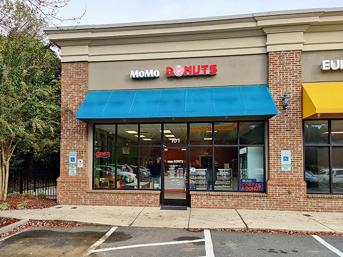 Clean brick and bright blue awning signal something special - where traditional meets innovative in delicious harmony.