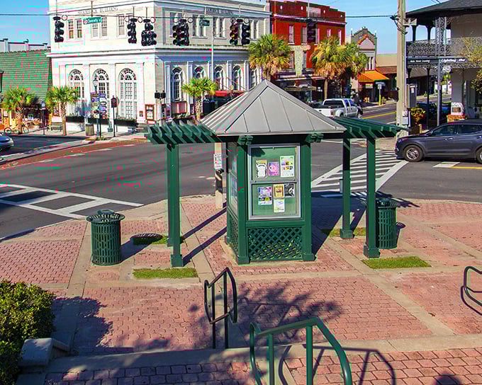 Historic buildings painted in cheerful colors line the brick-paved town square, where people actually stop to chat on benches.