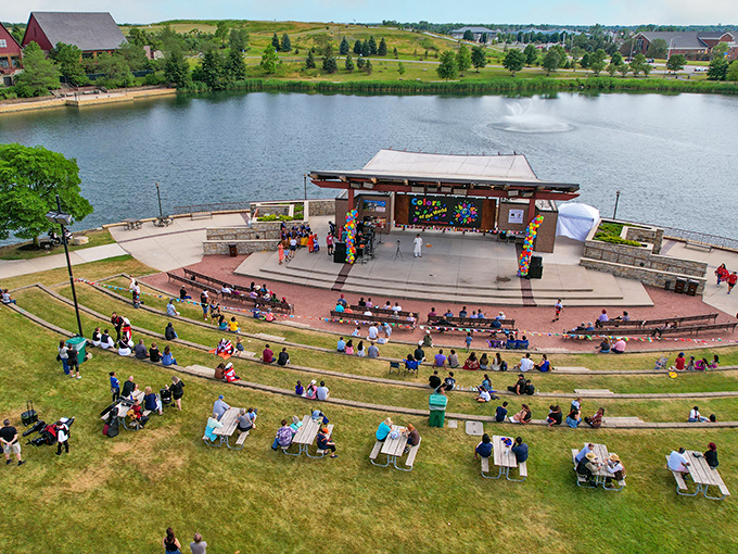 The serene waters of Munster's Centennial Park reflect Indiana skies, creating a peaceful retreat just minutes from urban bustle.