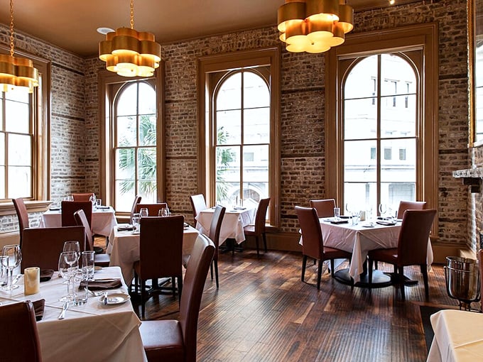 Exposed brick, arched windows, and tables set for culinary magic &ndash; Oak Steakhouse marries old-world charm with new-world flavors.
