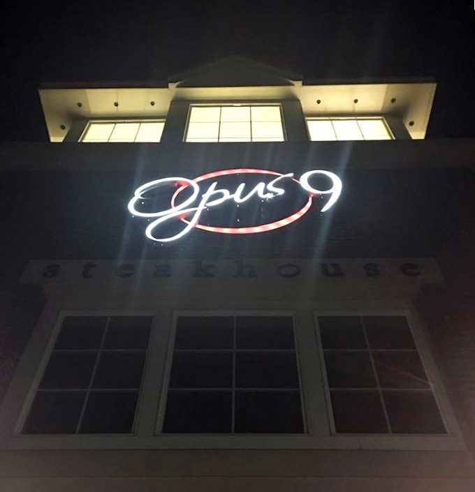 When the sun sets, Opus 9's glowing sign becomes a lighthouse guiding hungry travelers to a safe harbor of perfect steaks.