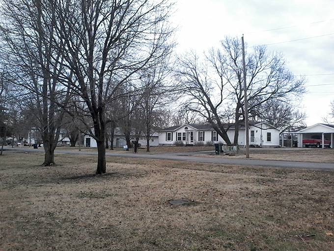 Modest homes line quiet streets in Osage City, where affordable housing means your golden years can truly shine without financial tarnish.