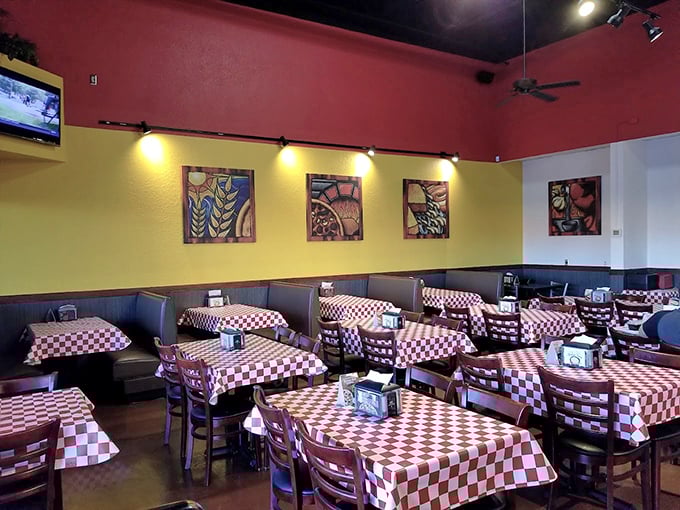 Red and yellow walls create the perfect backdrop for Pizza 9's comfort food classics. Those checkered tablecloths mean business!