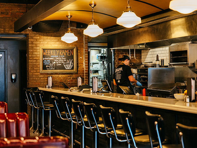 Exposed brick and pendant lights create the perfect backdrop for serious comfort food conversations.