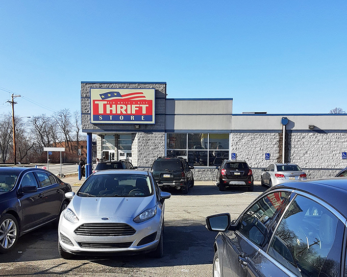 The Red White & Blue Thrift Store stands ready for bargain hunters under clear blue skies. Adventure awaits inside!
