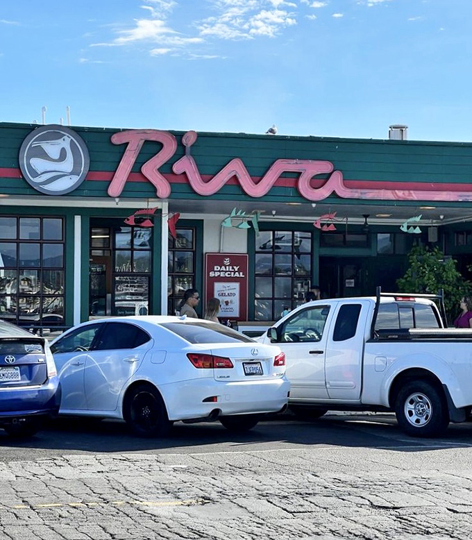 By day, Riva's pink sign stands out like a flamingo at a penguin convention&mdash;impossible to miss and worth the attention.