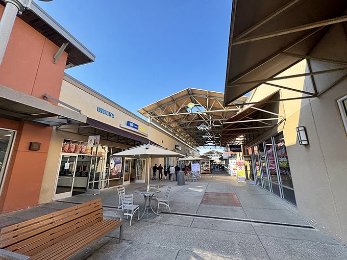 Adirondack chairs waiting patiently for shoppers whose arms need a rest from carrying all those deals.