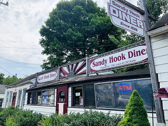 The Sandy Hook Diner sign promises a trip back to simpler times. Behind that modest exterior lies a world of pancake perfection that locals have treasured for generations.