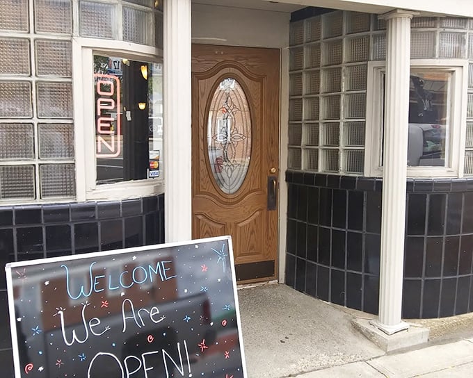 The "We Are Open" sign might be the best news you'll get today. Scratch's historic storefront guards modern steak mastery.
