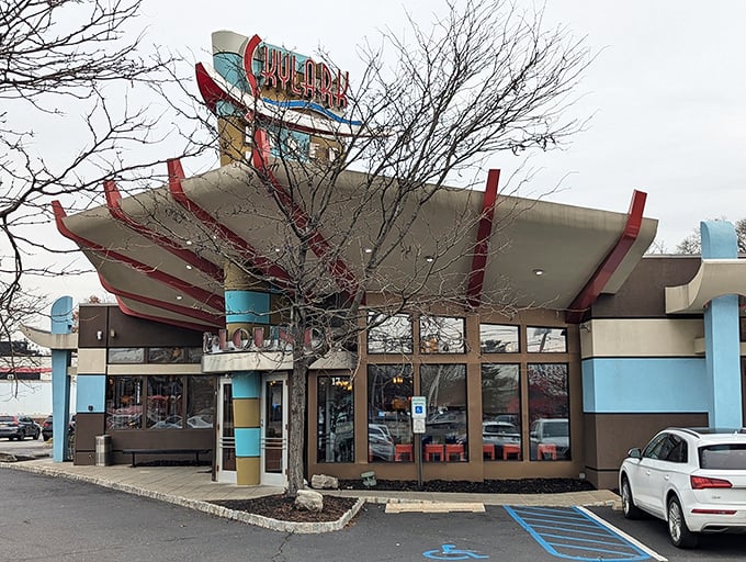 The retro-futuristic curves of this Edison landmark create a distinctive silhouette against the New Jersey sky.