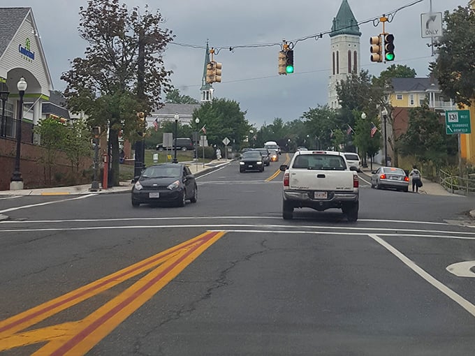 Cruising through downtown Southbridge where church spires peek above the treeline – small-town charm with traffic lights that actually change before your Social Security check arrives.