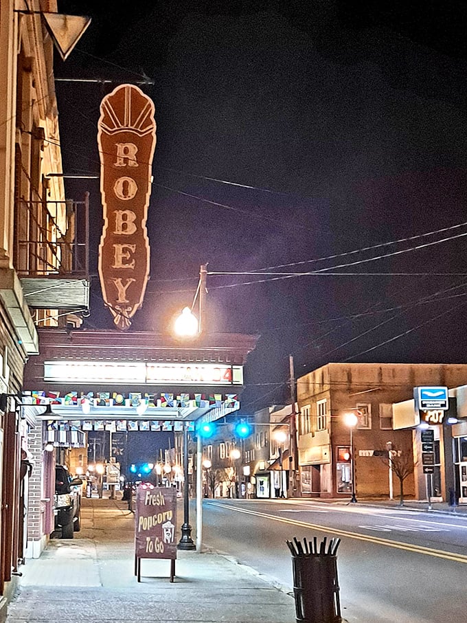 The Robey Theatre's vintage sign glows against the night sky, beckoning moviegoers just as it has for generations.