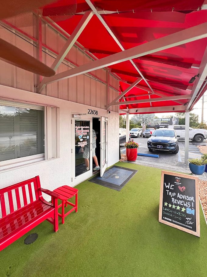 The no-frills exterior with artificial turf and red bench sets a casual tone. In the Keys, it's never about the packaging&mdash;it's about the fresh-caught treasures inside.