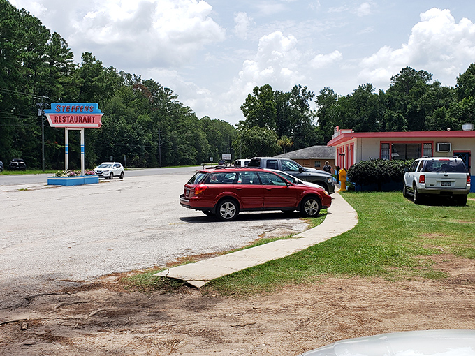 Steffens Restaurant's vintage sign stands tall against Georgia pines, guiding hungry travelers to breakfast salvation since before GPS existed.