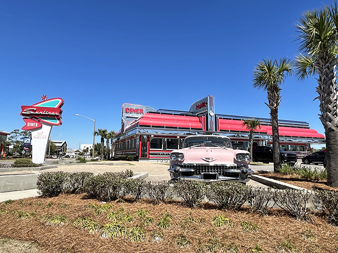 That pink Cadillac isn't just for show – it's your first clue that the Sunliner takes its 1950s aesthetic as seriously as its comfort food.