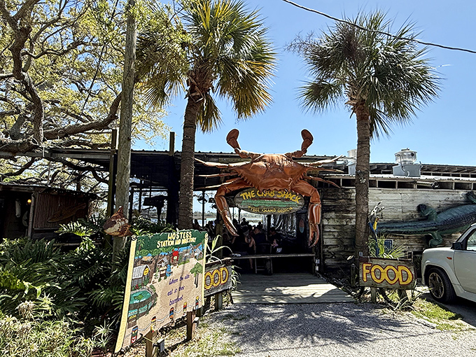 When a restaurant entrance features a massive crab sculpture, you know they're serious about seafood. The "GOOD FOOD" sign is just stating facts.