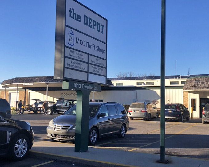 "The DEPOT" sign stands tall, guiding thrift enthusiasts to their destination. Like a lighthouse for the bargain-bound, it promises safe harbor for your wallet.