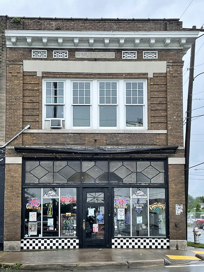 Sunlight reveals Vino's historic brick charm, where diamond-patterned windows have witnessed decades of pizza perfection.