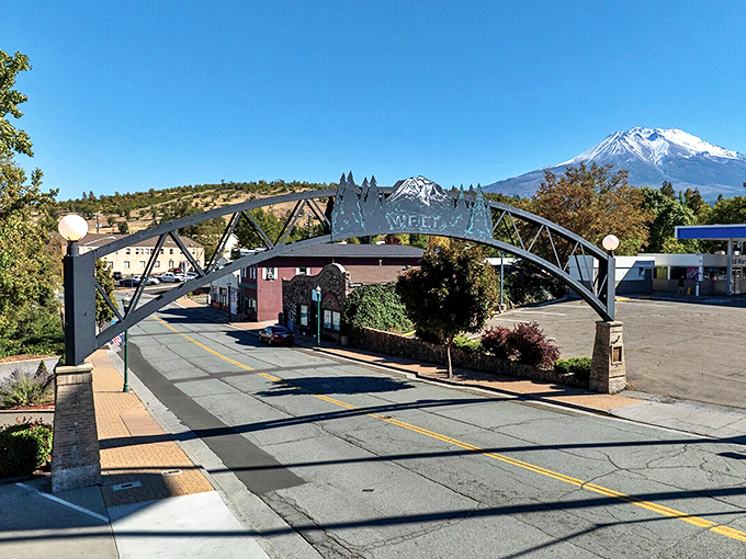 Weed's welcome arch frames the town perfectly, like a gateway to simpler times where mountain air comes standard with every visit.