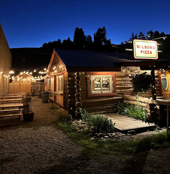 String lights and starry nights make the perfect pizza pairing! This log cabin transforms into a magical dining experience after sunset.