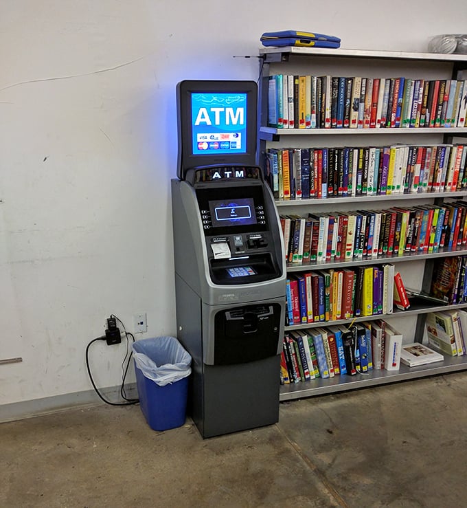 An ATM stands guard by the book section &ndash; a reminder that even in bargain heaven, some currency exchange is necessary.