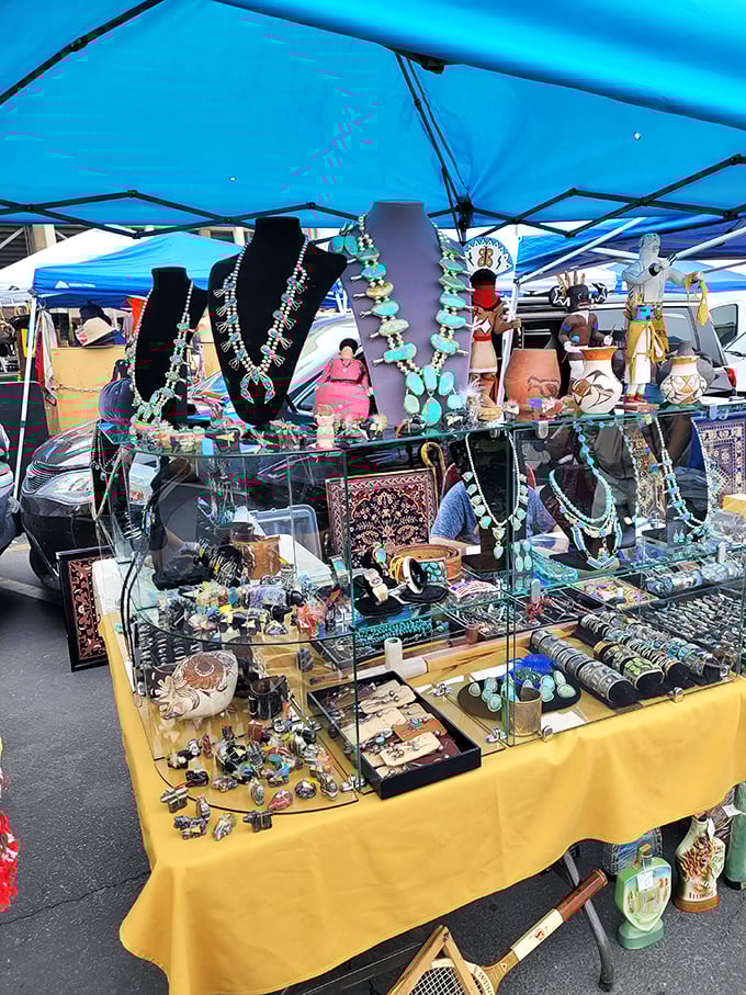 Turquoise treasures and Native American jewelry sparkle under the tent's blue glow. These necklaces have stories that span generations and landscapes.