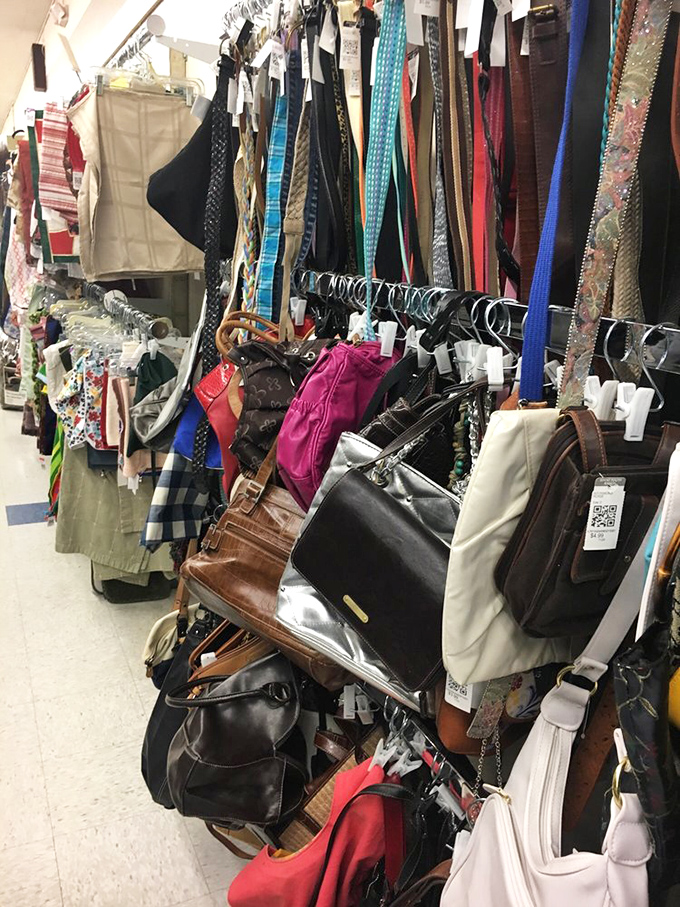 Handbag heaven! Designer lookalikes and genuine vintage pieces dangle like fashionable fruit, ripe for the picking.