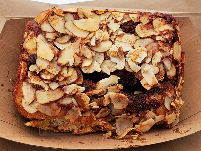The almond roll showcases thin, toasted slices that add both crunch and a subtle nuttiness. It's like the sophisticated European cousin in the cinnamon roll family.
