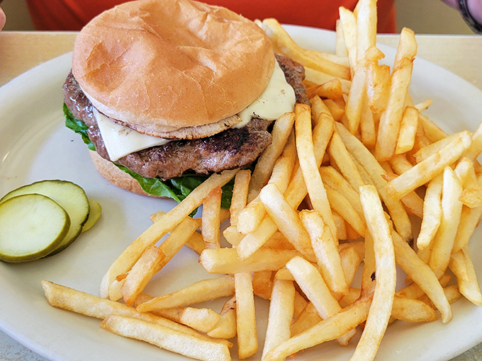 A classic burger and fries that doesn't need Instagram filters or fancy aioli&mdash;just honest beef, melty cheese, and fries that actually taste like potatoes.