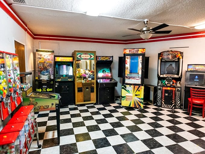 Between features, the arcade room beckons with its checkered floor and nostalgic games, offering analog thrills in our digital world.